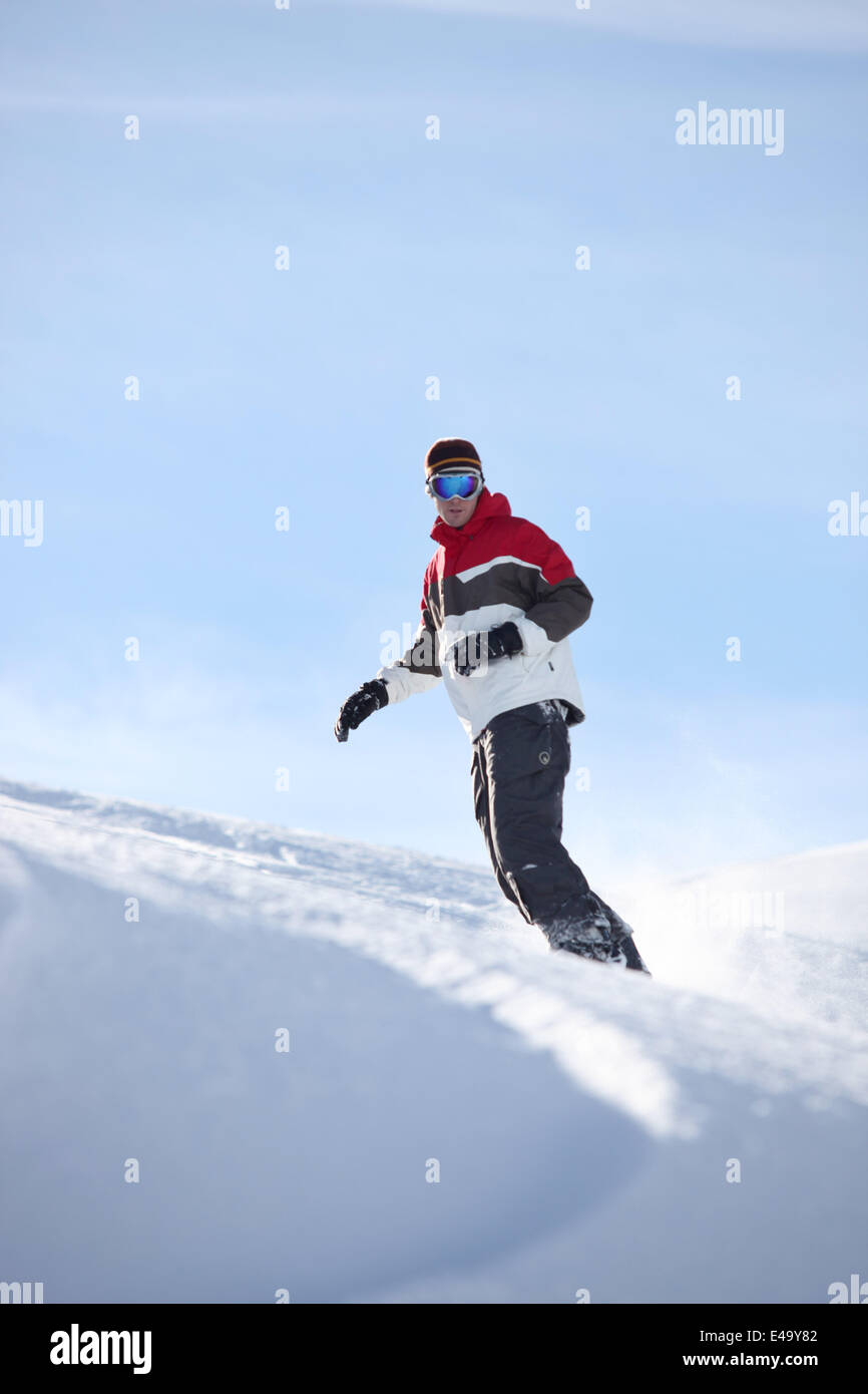 Man snowboarding alone Stock Photo - Alamy