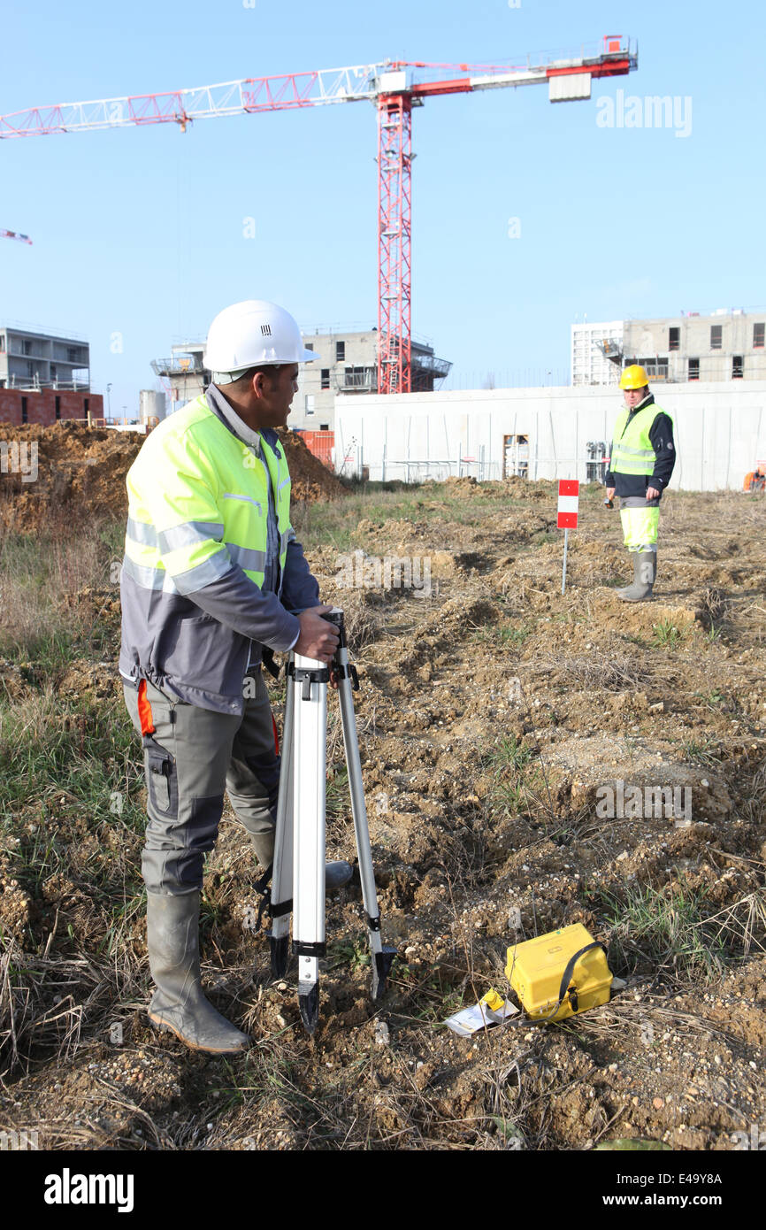 Workers on construction site Stock Photo - Alamy