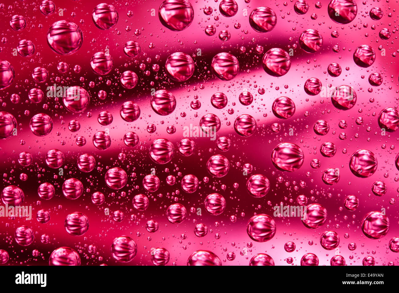 Water drops on red glass surface Stock Photo - Alamy