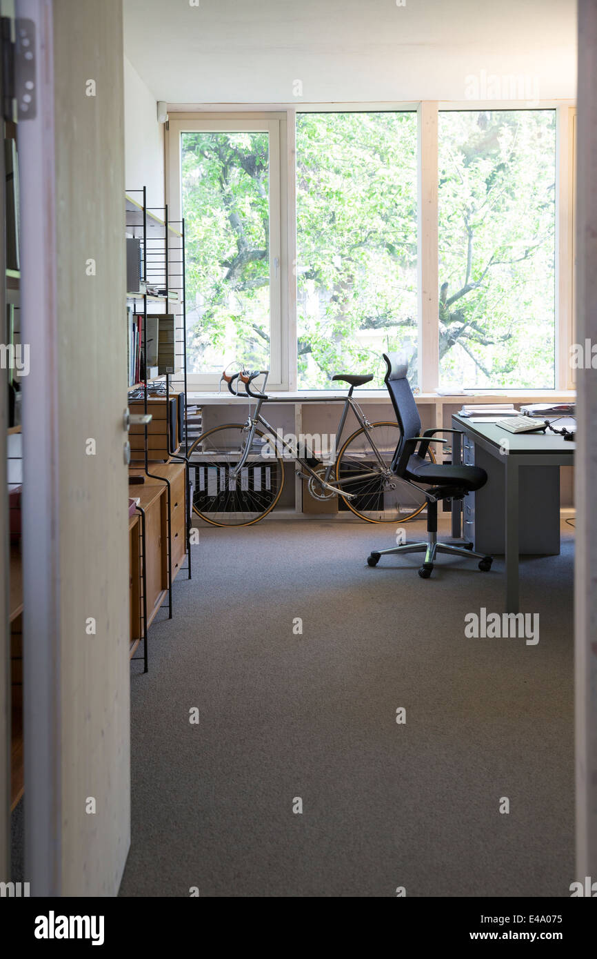 Racing cycle standing at workplace of modern office Stock Photo - Alamy