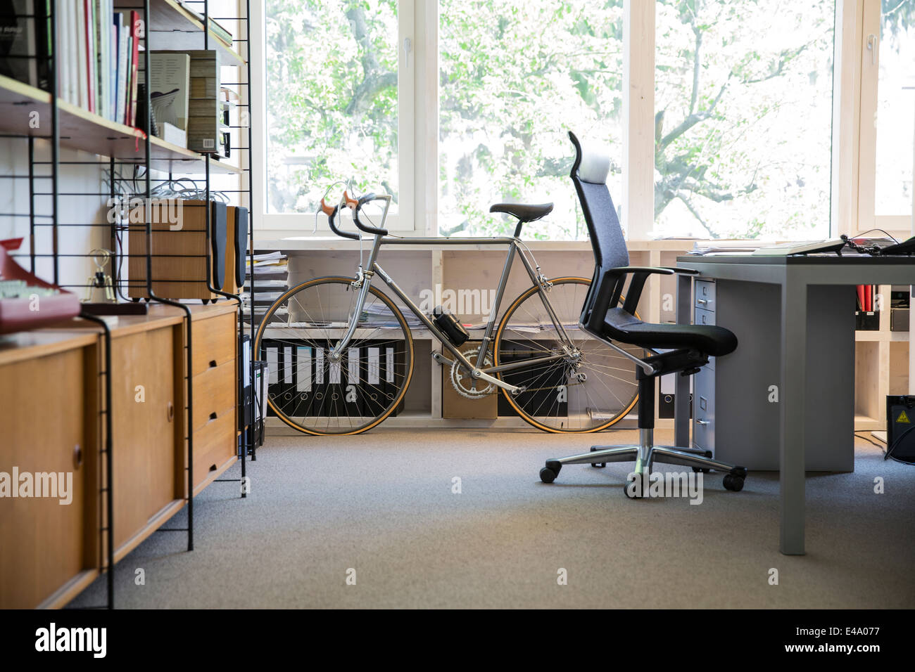 Racing cycle standing at workplace of modern office Stock Photo - Alamy