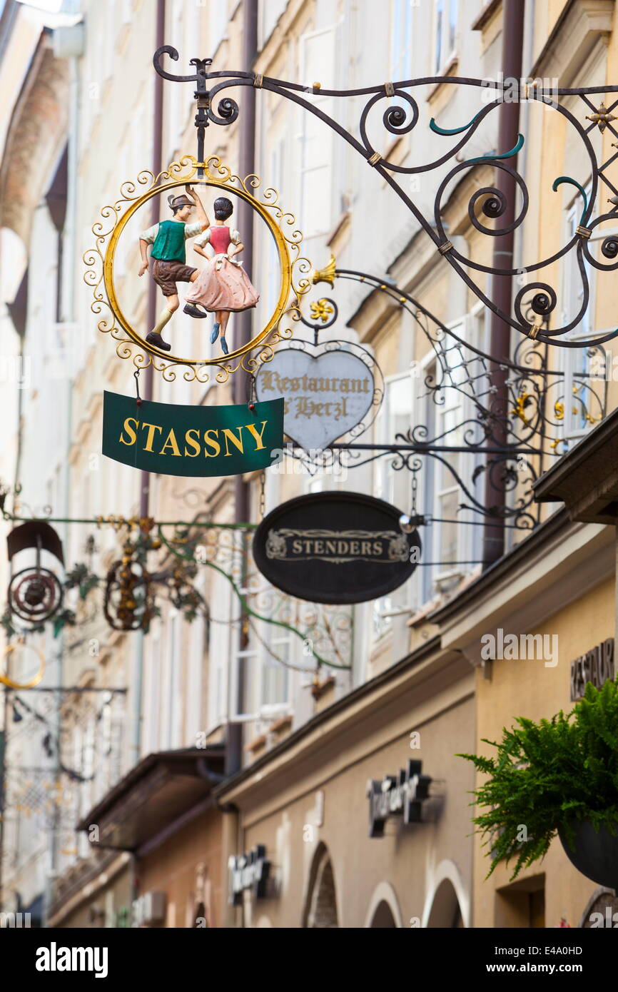 Ornate shop signs on Getreidegasse, Salzburgs bustling shopping street ...