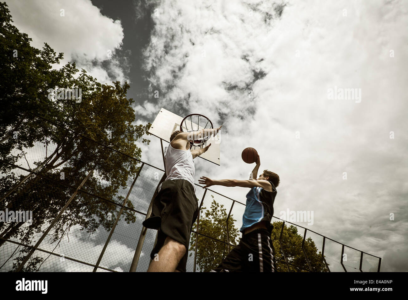 Two young basketball players at duel Stock Photo - Alamy