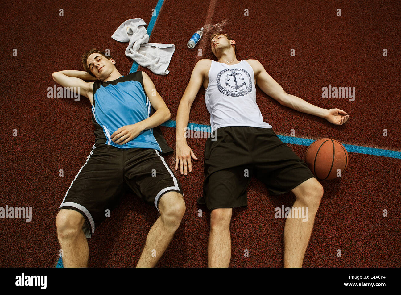Young man lying on basketball hi-res stock photography and images - Alamy