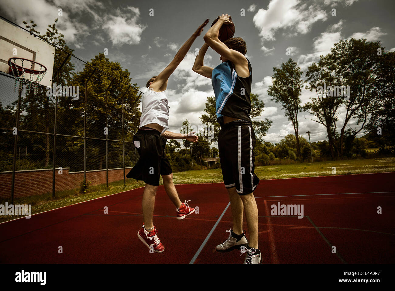 Two young basketball players at duel Stock Photo - Alamy