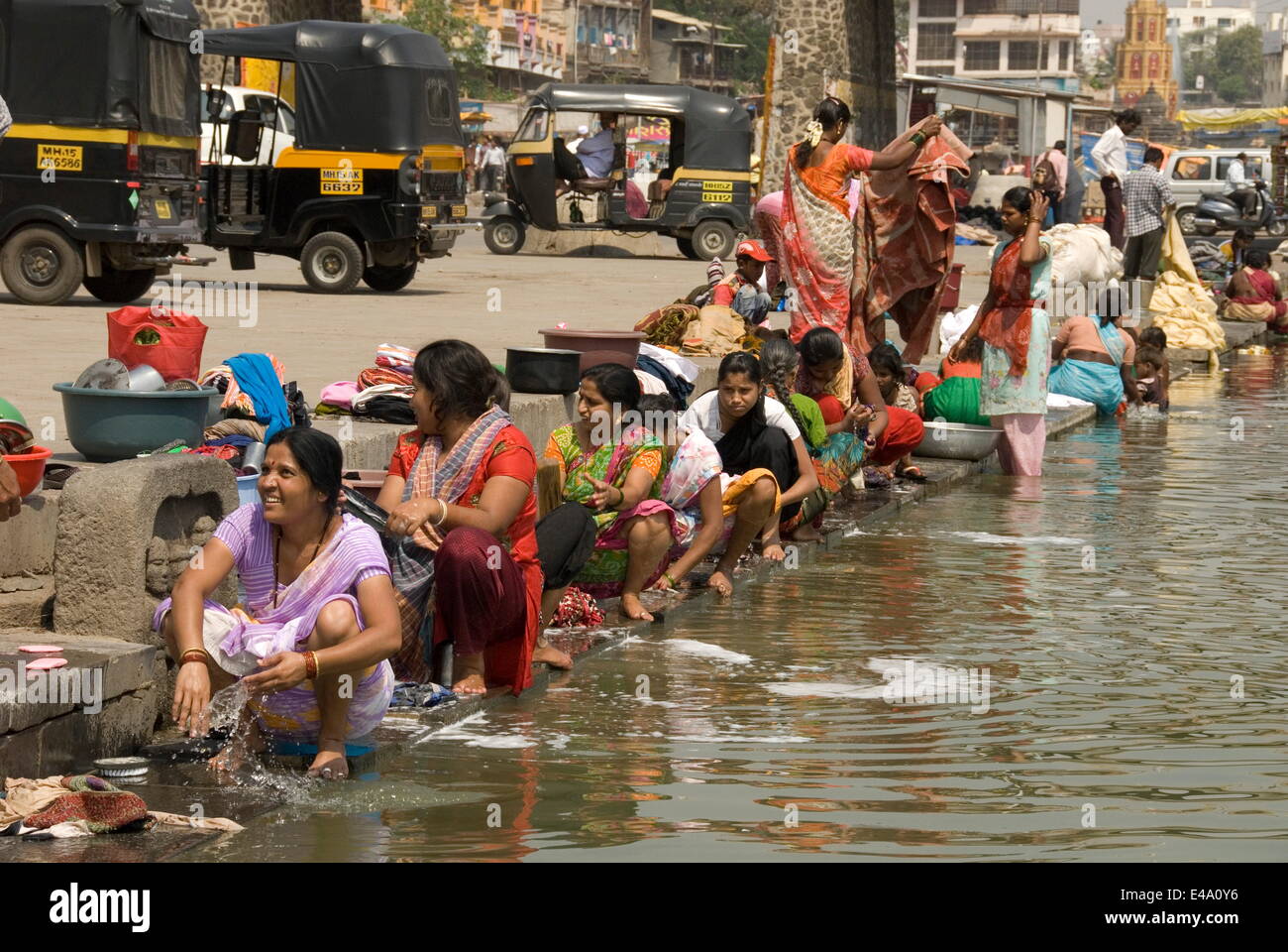 Women washing at the ghats along the holy River Godavari, Nasik (Nashik ...