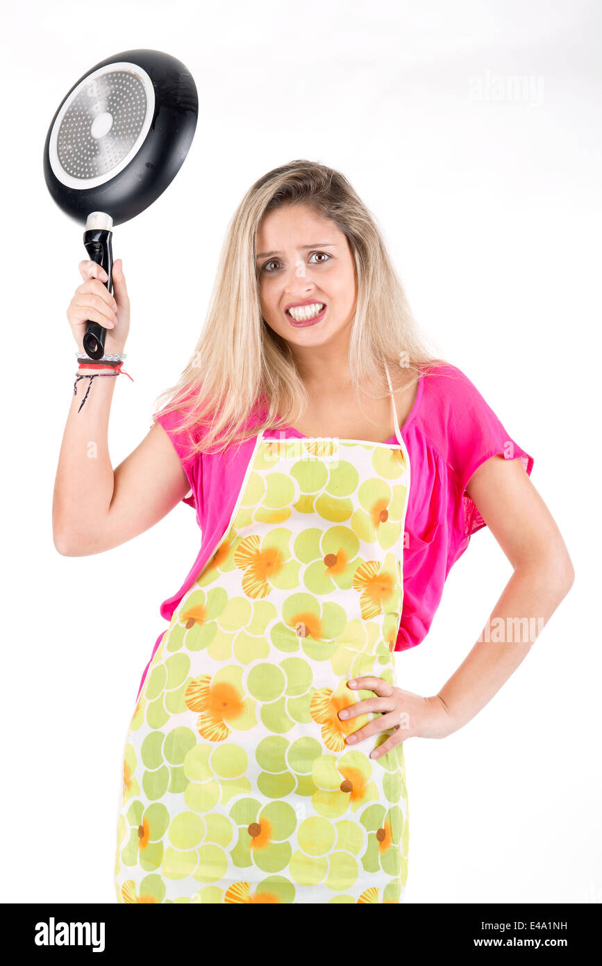 Beautiful angry woman with apron and frying pan Stock Photo - Alamy