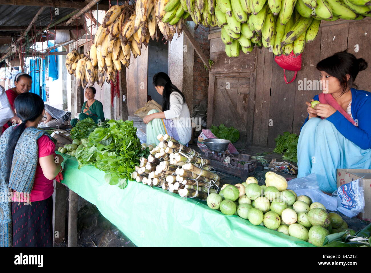 Women selling locally grown produce in remote rural market on a ...