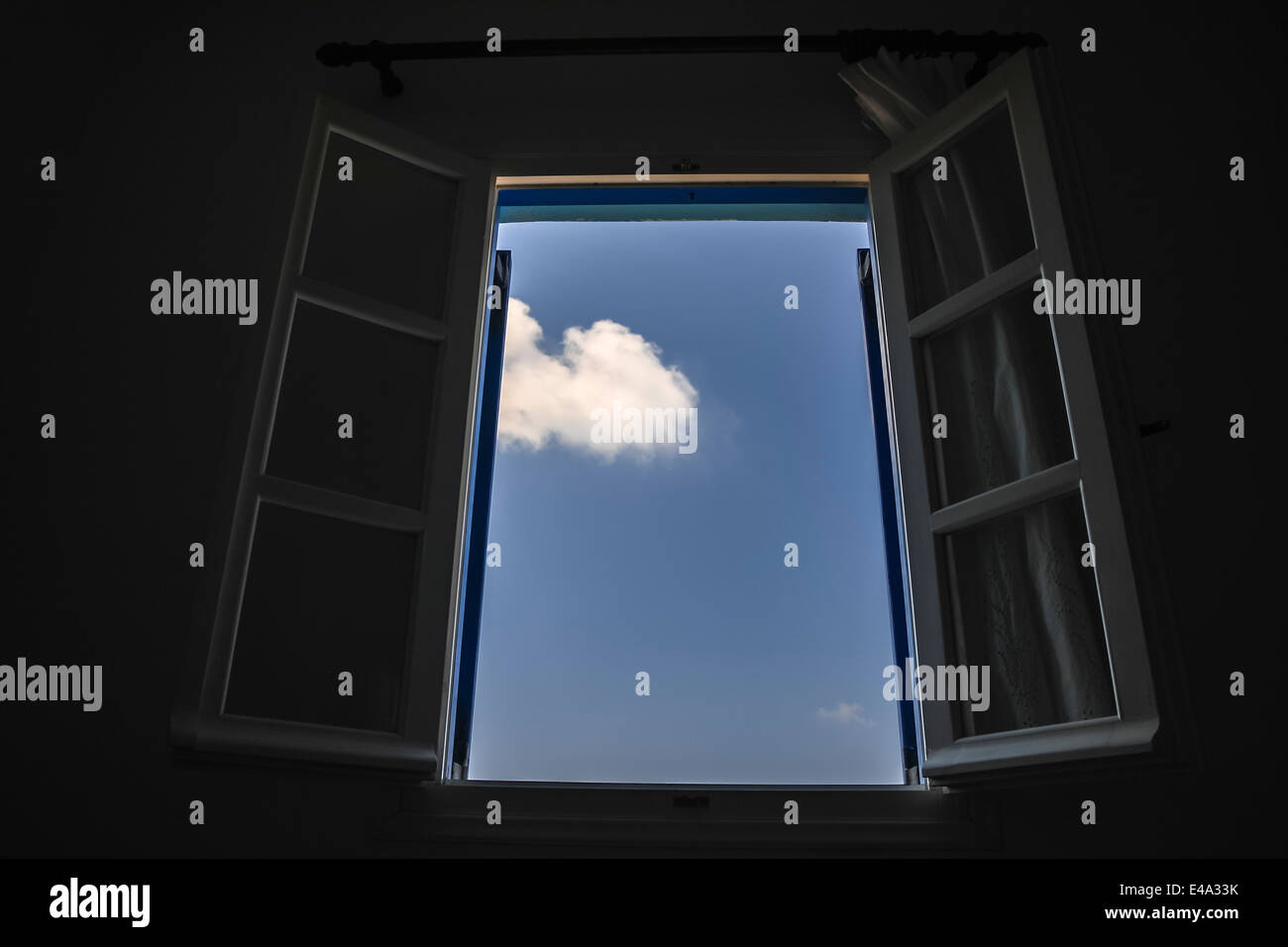 Greece, Cyclades, Naxos, View through an open window, Blue sky and ...