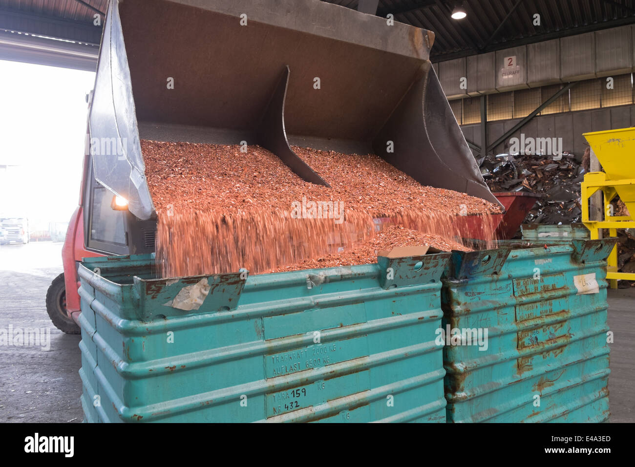Excavator shovel unloading scrap in a scrap metal recycling plant Stock ...