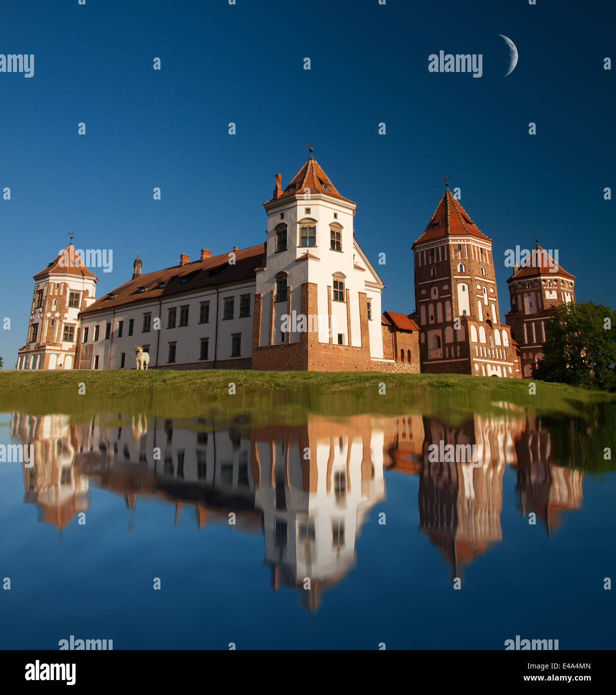 beautiful red brick castle stands in Europe.reflection in the water ...