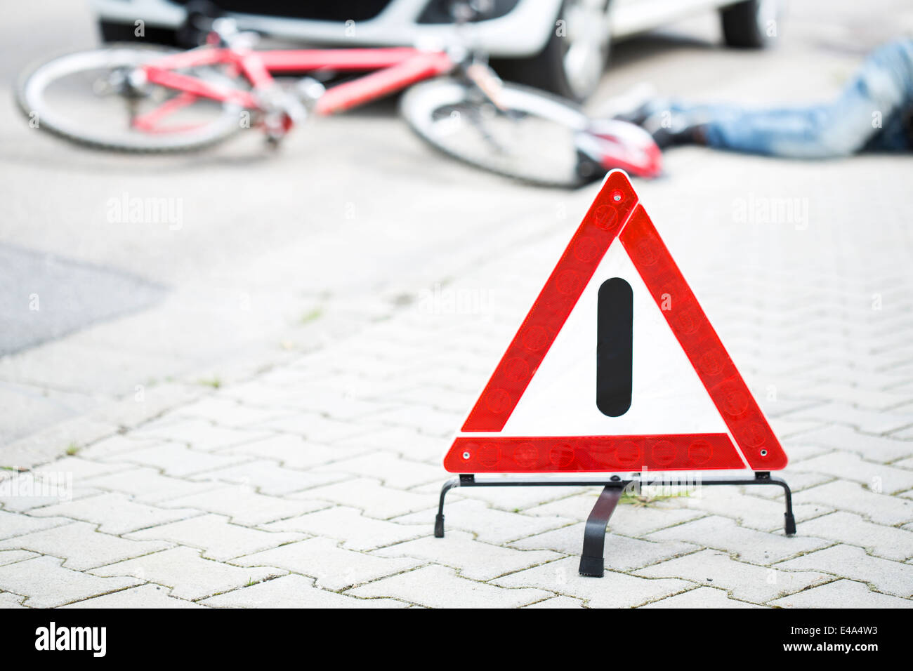 Warning triangle in front of crash scene Stock Photo - Alamy