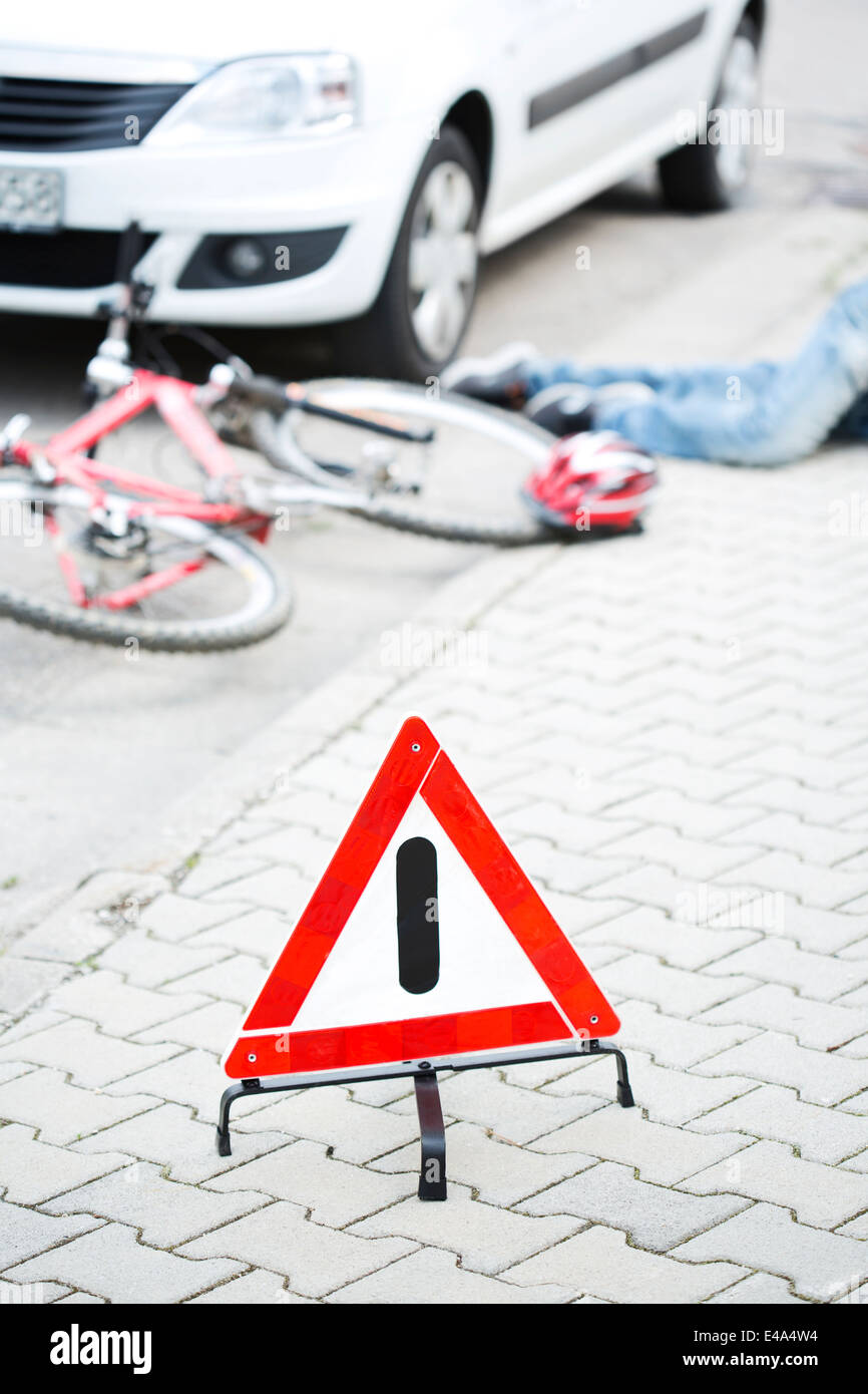 Warning triangle in front of crash scene Stock Photo - Alamy