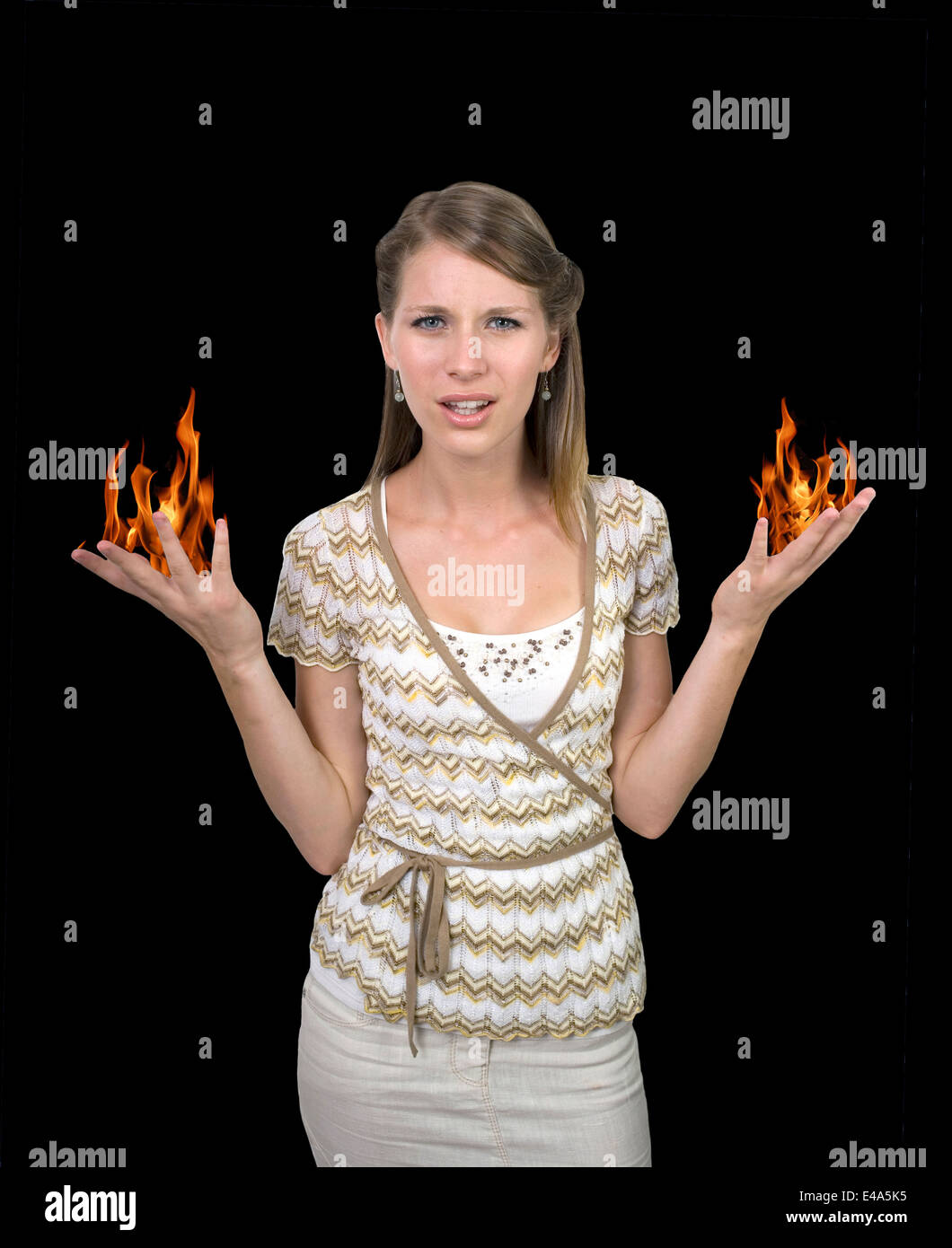 Girl against plain black background with flames Stock Photo - Alamy