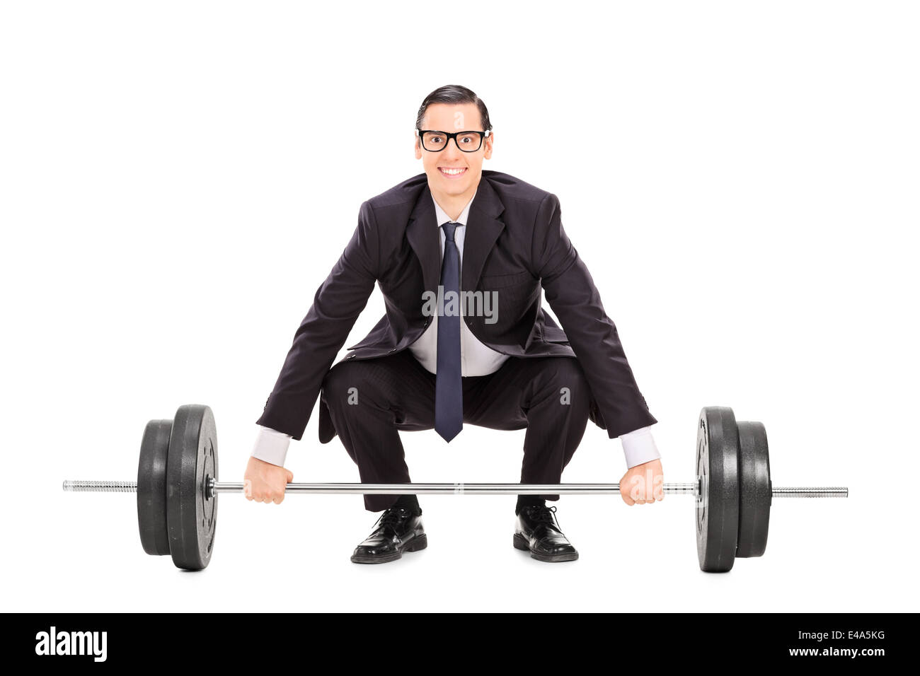 Businessman lifting a heavy weight Stock Photo - Alamy