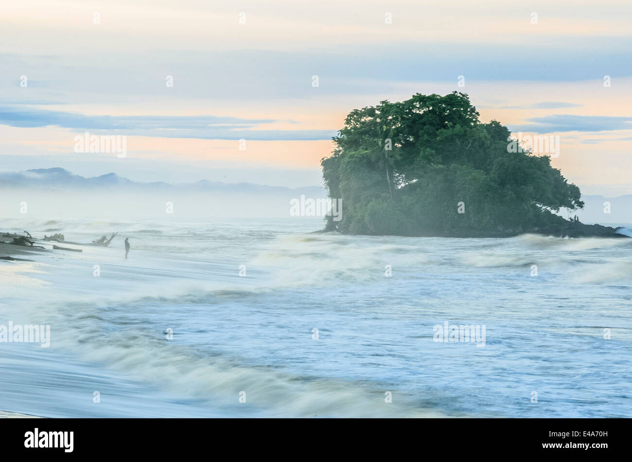 Tourist watching the sunrise on the Bahia Solano beach Stock Photo - Alamy