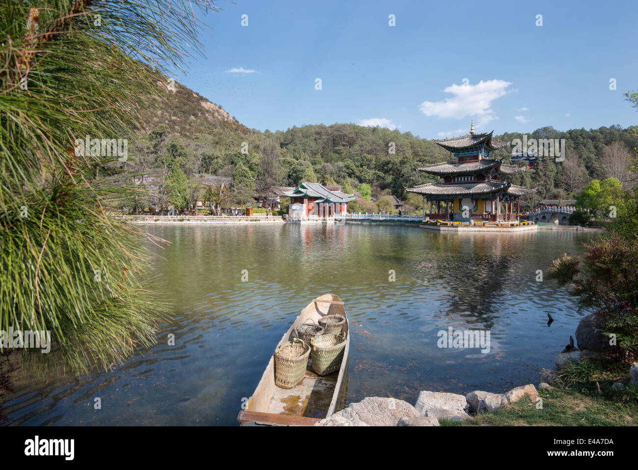 Jade Spring Park and Black Dragon Pool with boat carrying wicker ...
