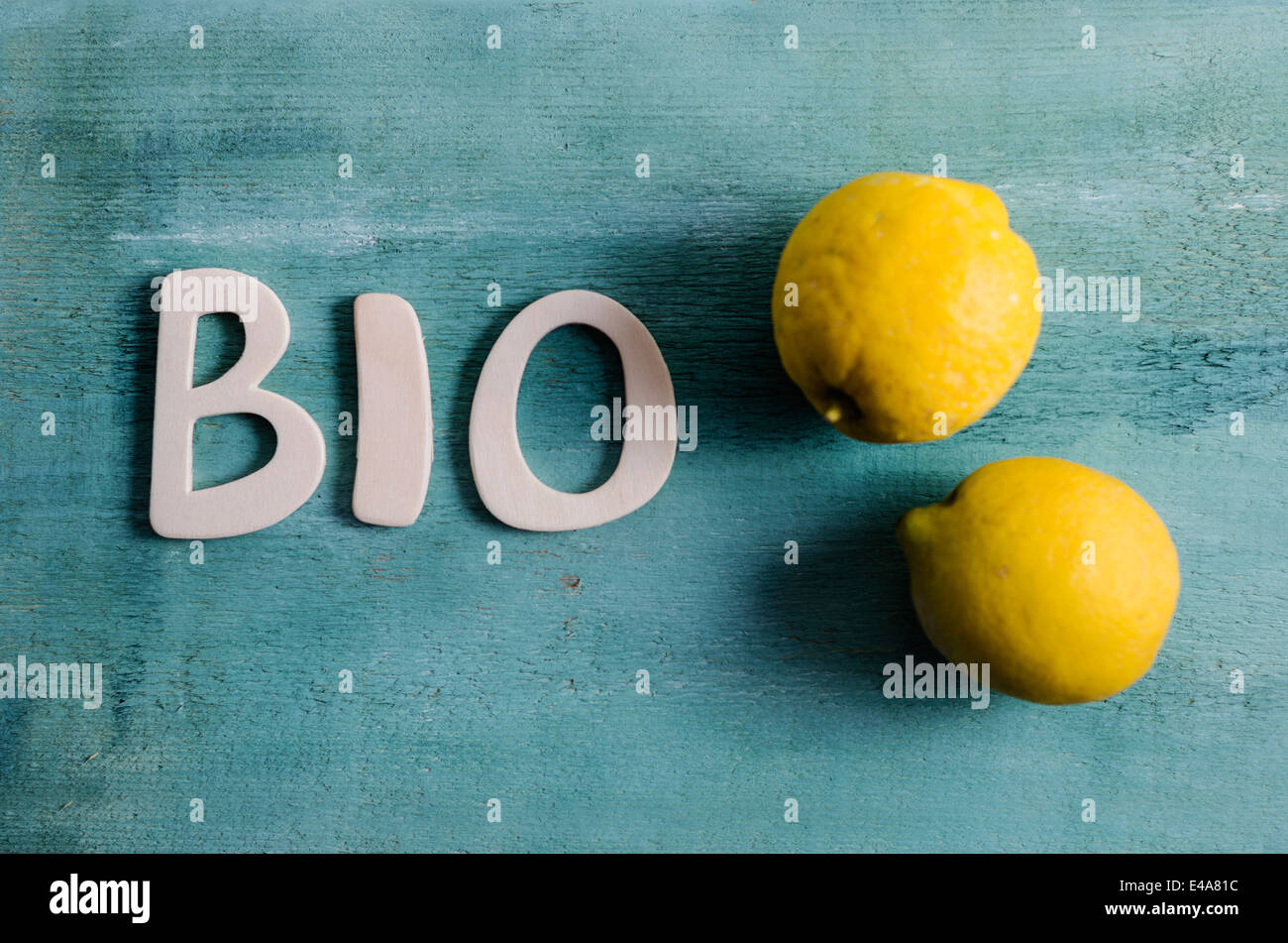 The word bio and two lemons on coloured wood, elevated view Stock Photo ...