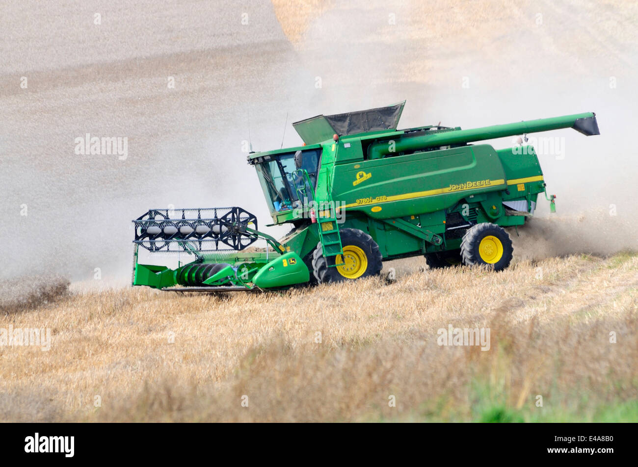 Combine harvester working Stock Photo - Alamy
