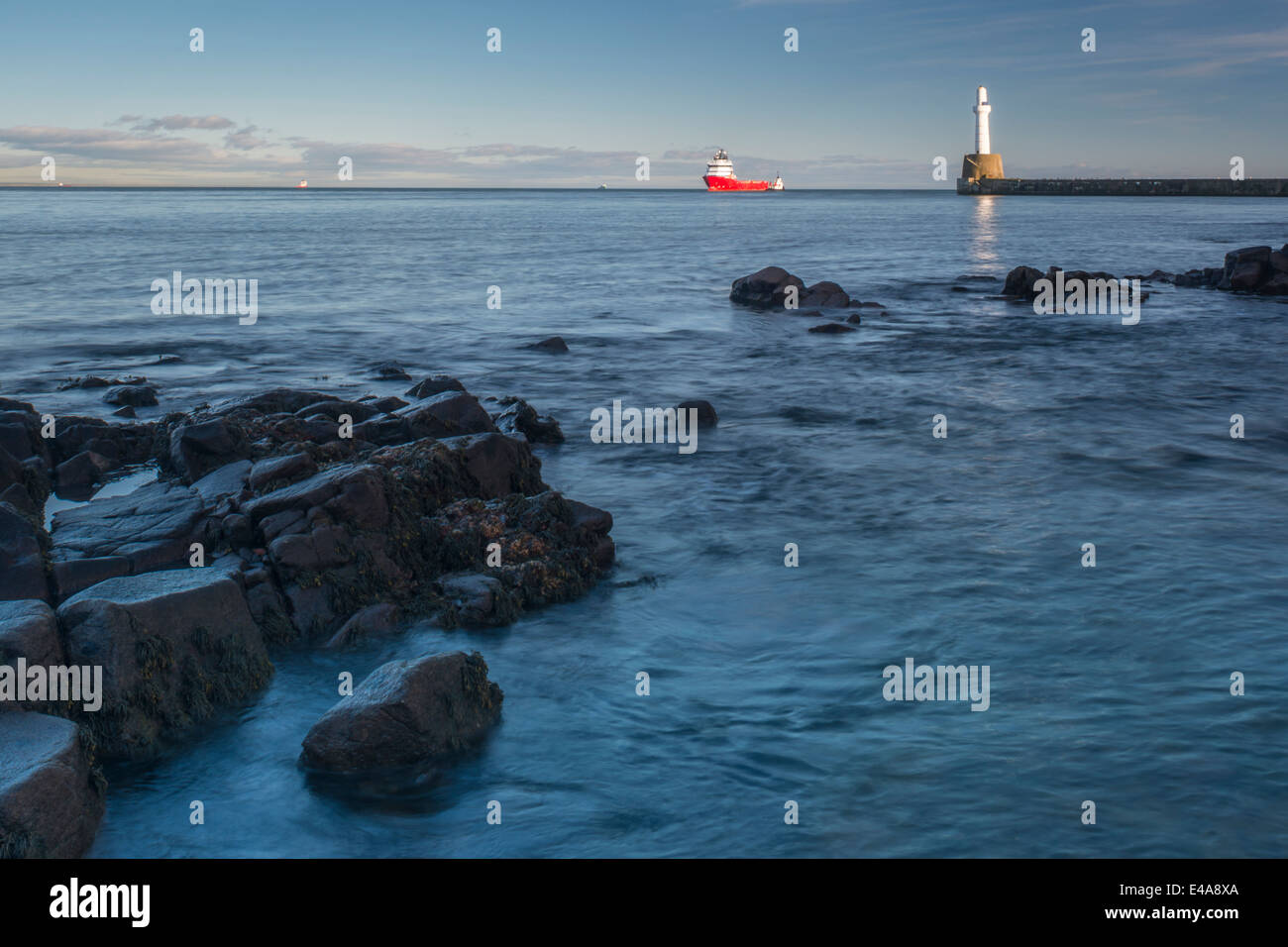 Boat entering Aberdeen and the River Dee near the battery, Scotland ...