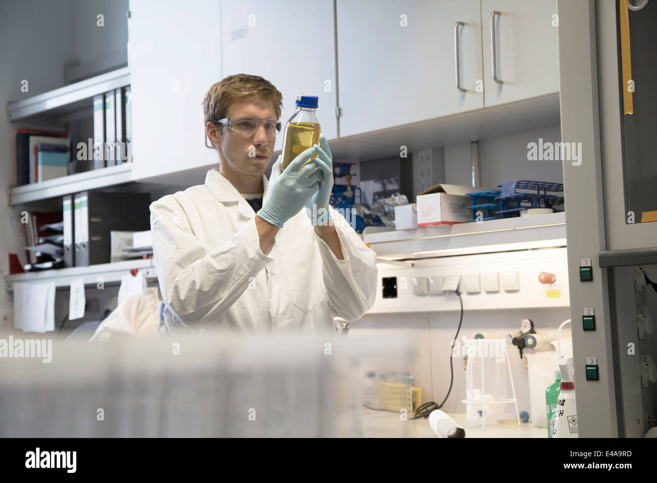 Scientist in a biological lab analyzing liquid Stock Photo - Alamy