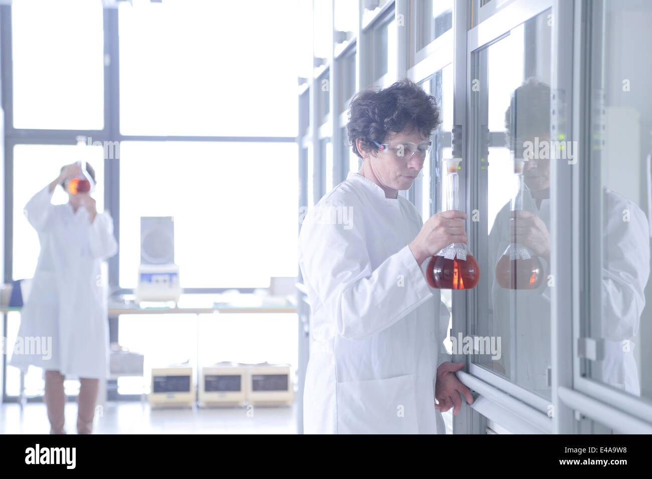 Two female chemists working in lab Stock Photo - Alamy