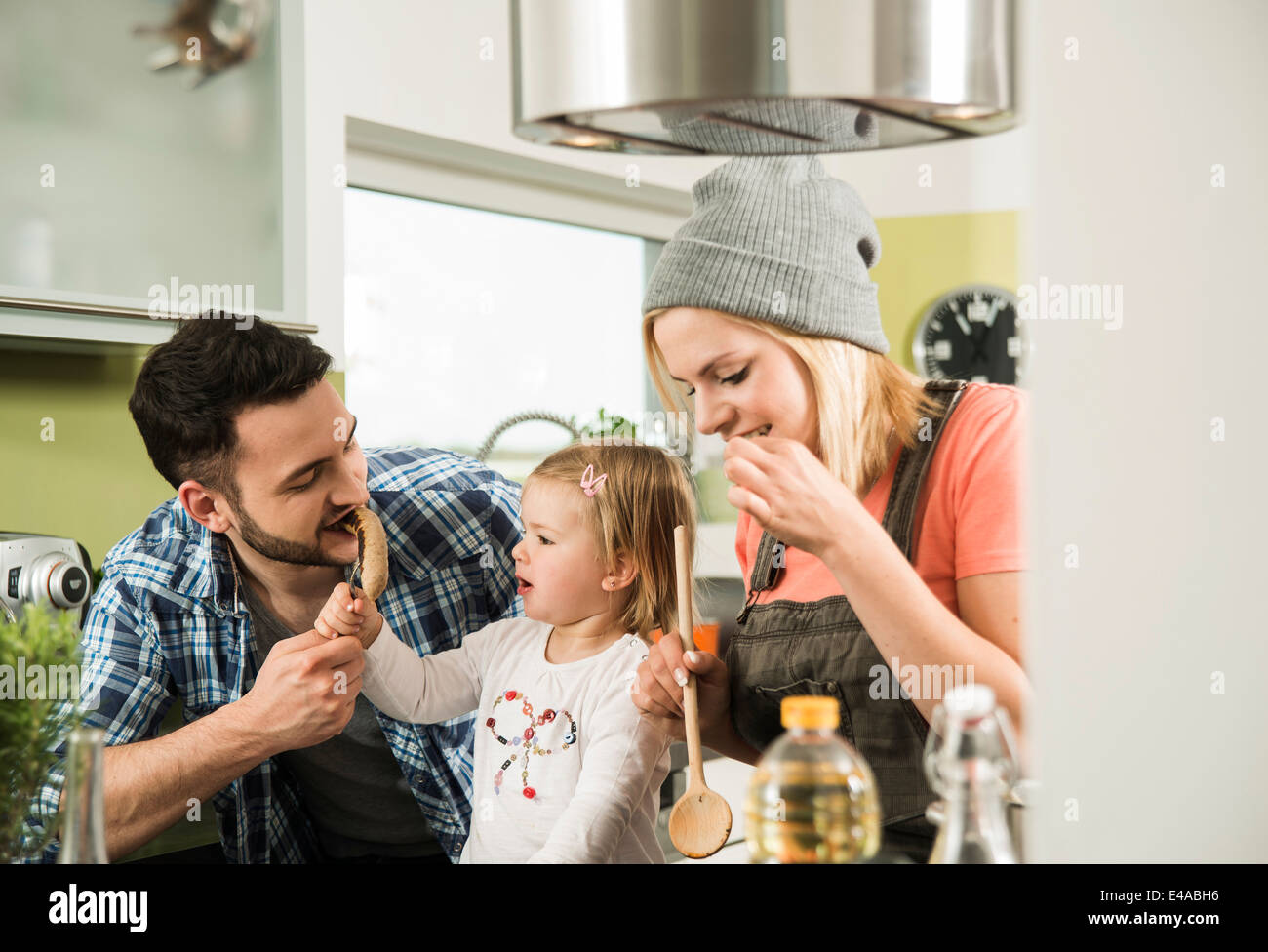 Family cooking in kitchen at home Stock Photo - Alamy