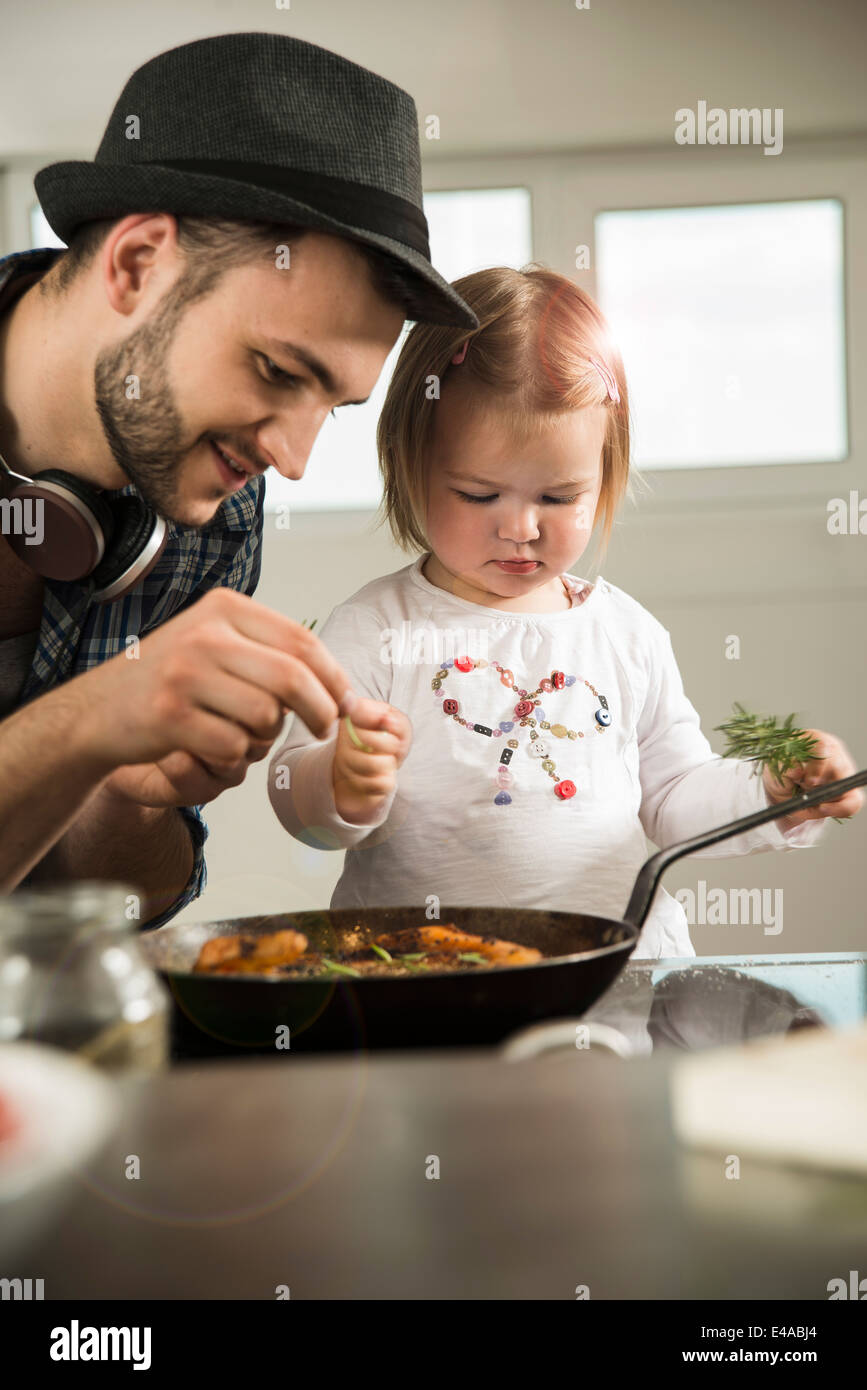Father and daughter cooking in kitchen Stock Photo - Alamy