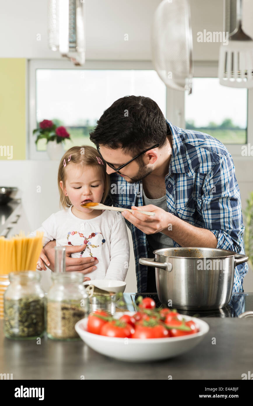 Father and daughter cooking in kitchen Stock Photo - Alamy