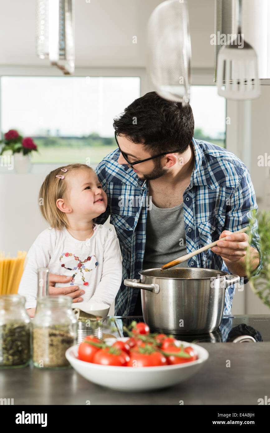 Father and daughter cooking in kitchen Stock Photo - Alamy