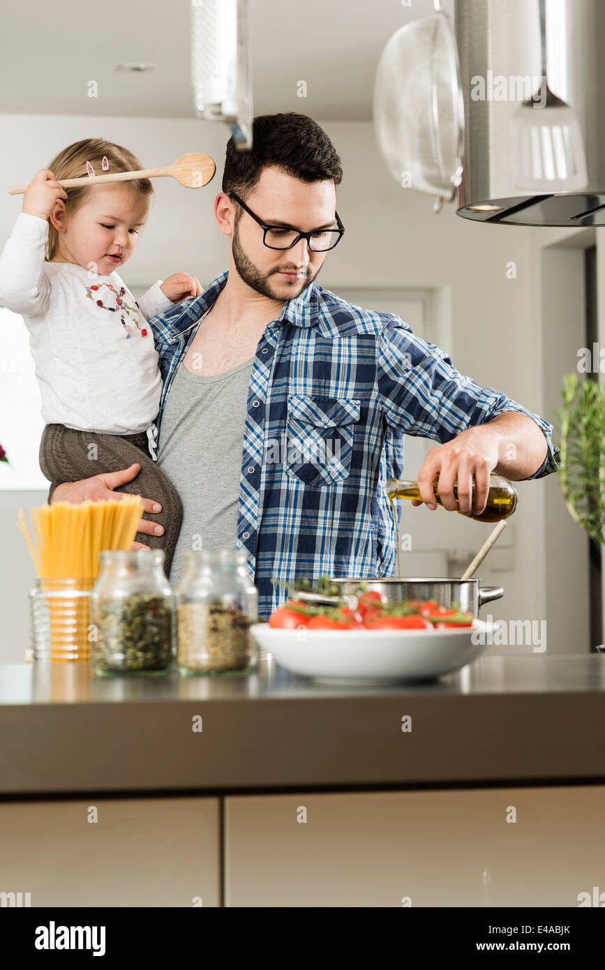 Father and daughter cooking in kitchen Stock Photo - Alamy