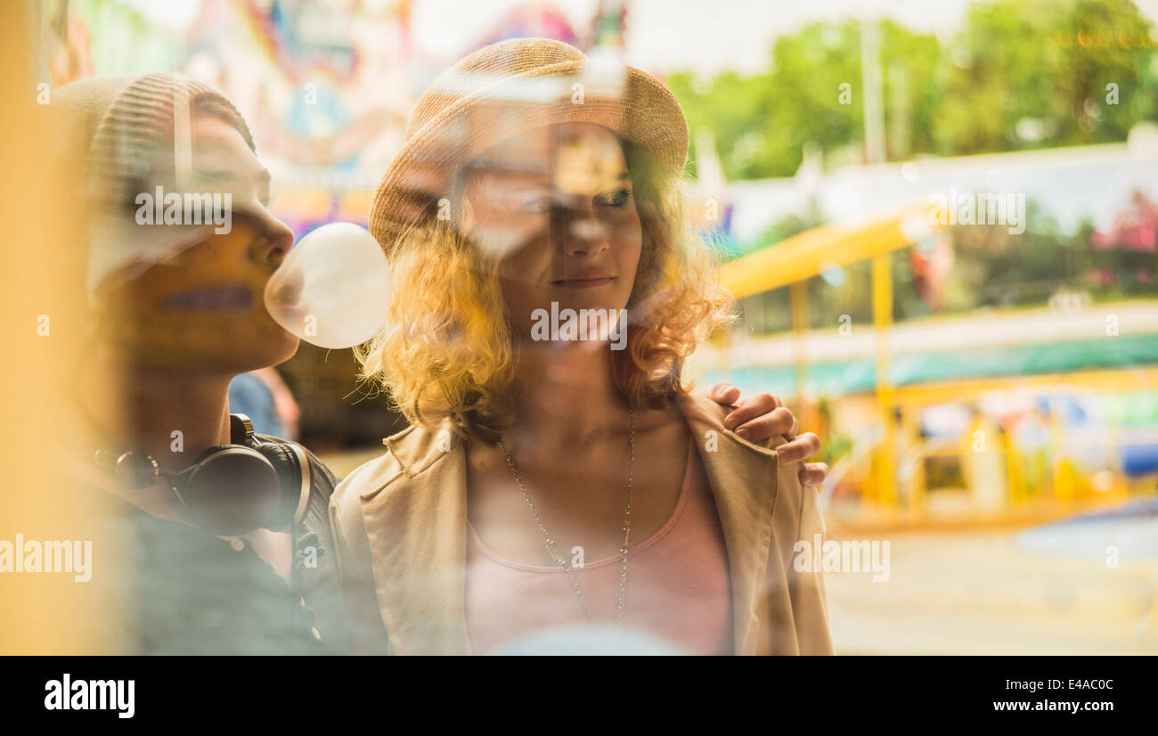 Teenage couple at fun fair Stock Photo - Alamy