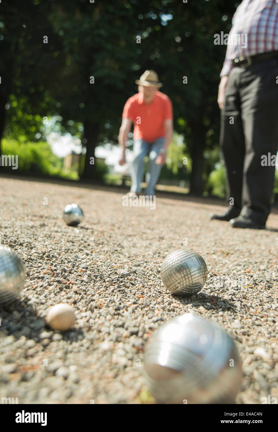 Two old friends playing boule in the park Stock Photo - Alamy