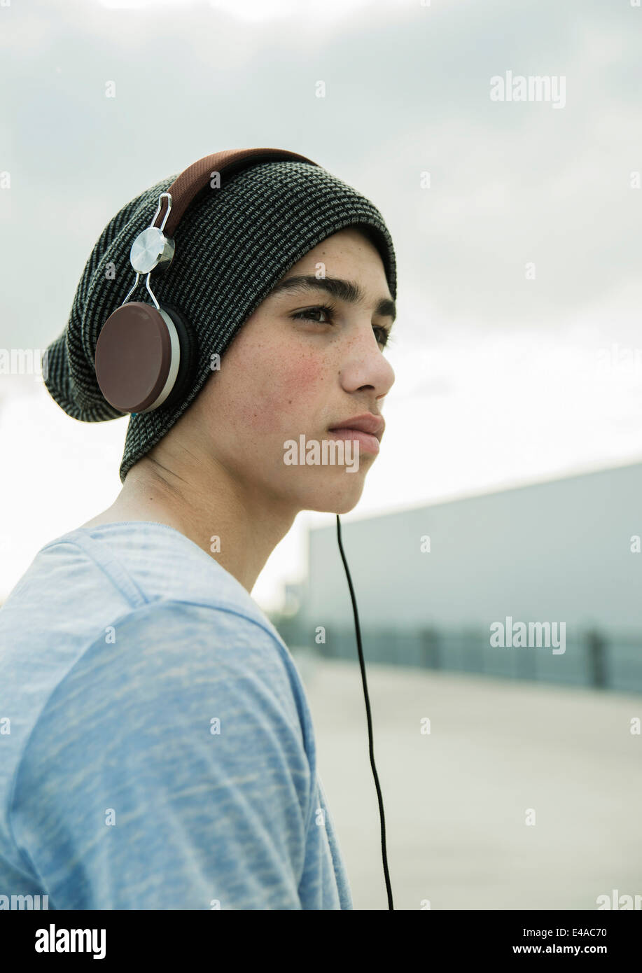 Boy wearing headphones outdoors Stock Photo - Alamy