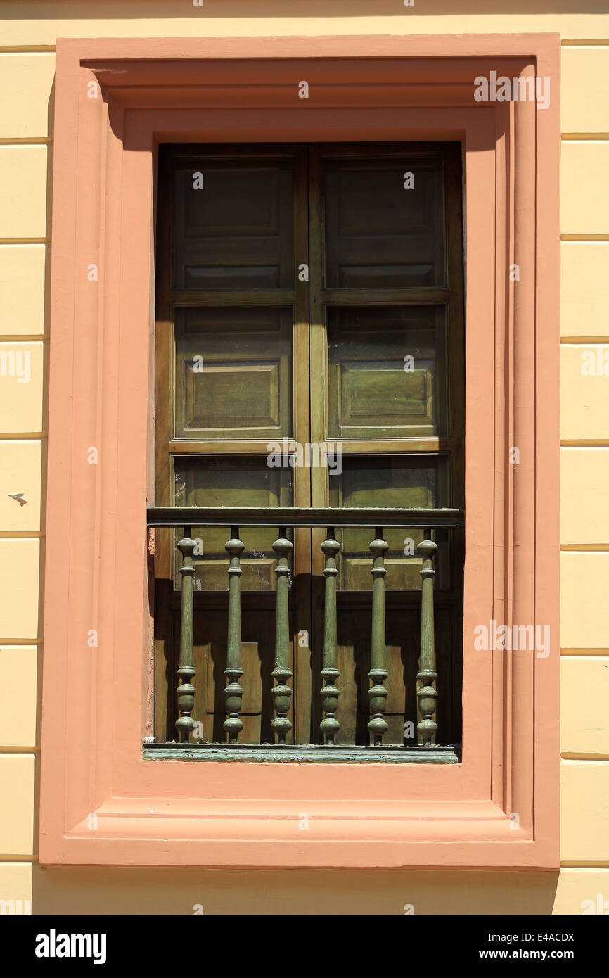 A window with wooden shutters in a building in Cotacachi, Ecuador Stock ...