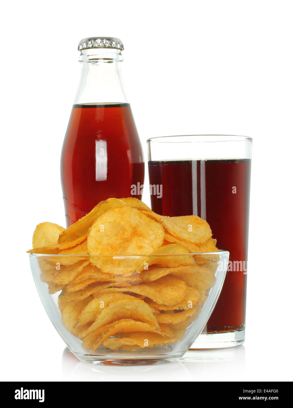 Bottle and glass of cola with potato chips on white background Stock ...