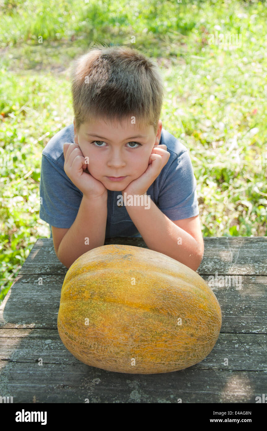 boy child melons harvest sitting alone holding day sunny portrait large ...