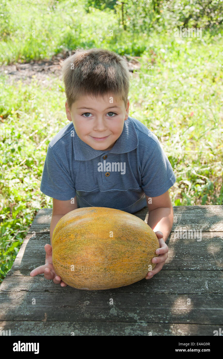 boy child melons harvest sitting alone holding day sunny portrait large ...