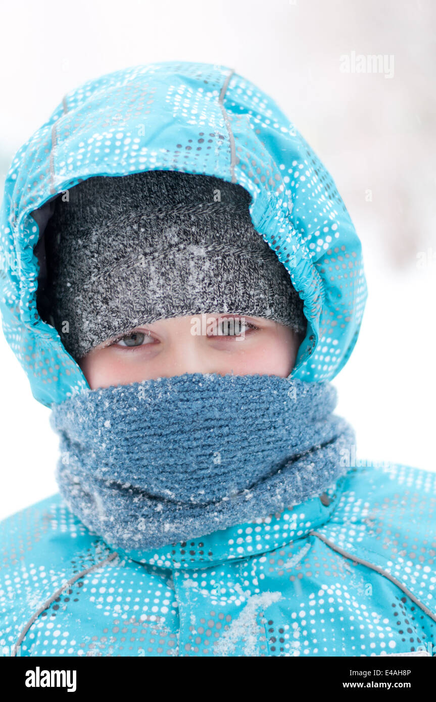 boy child portrait one eight years winter clothes blizzard snow frost ...