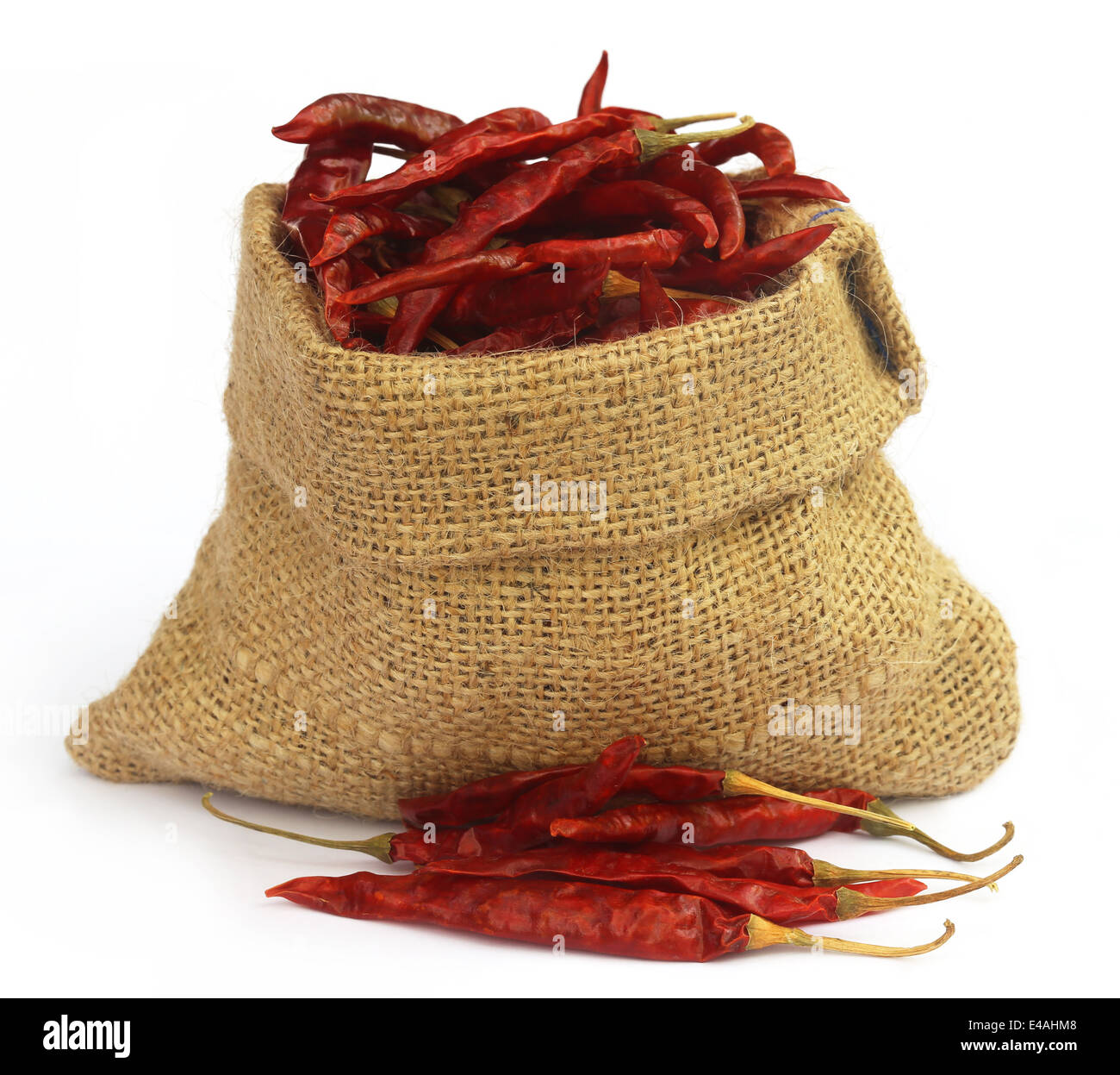 Red hot chilies with a sack over white background Stock Photo - Alamy