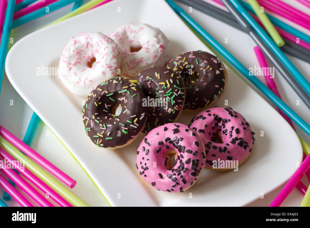 Plate of six decorated doughnuts Stock Photo - Alamy