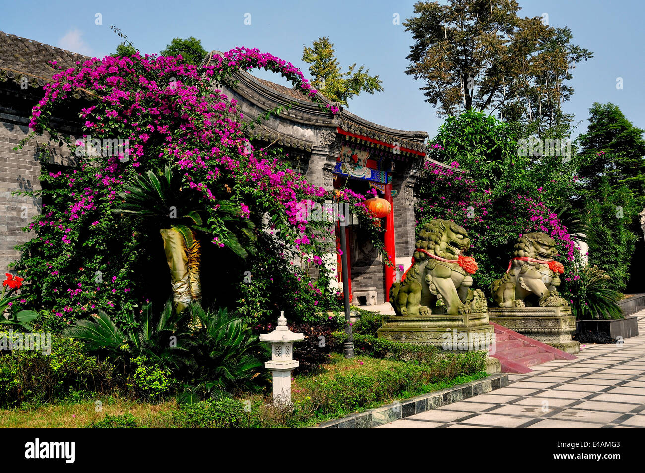 PENGZHOU, CHINA: Chinese home with stone tiled roofs, two guardian Fu ...