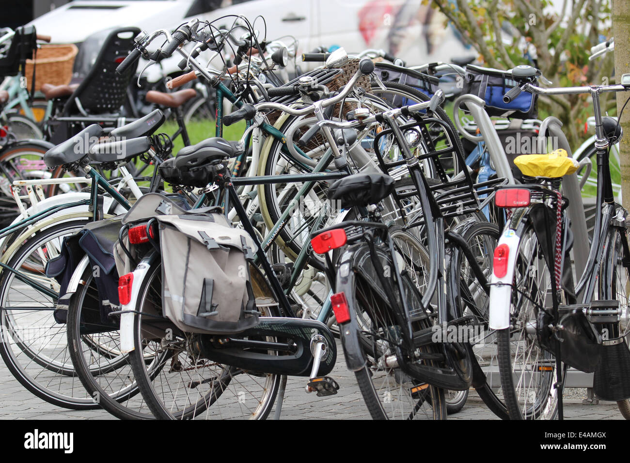Many bikes on sidewalk Stock Photo - Alamy