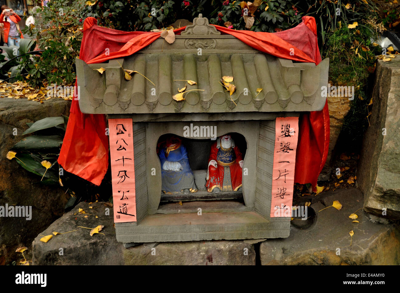 CHENGDU, CHINA: A miniature Buddhist shrine containing two ceramic ...
