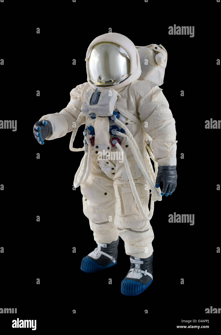 Astronaut wearing spacesuit against a black background Stock Photo - Alamy