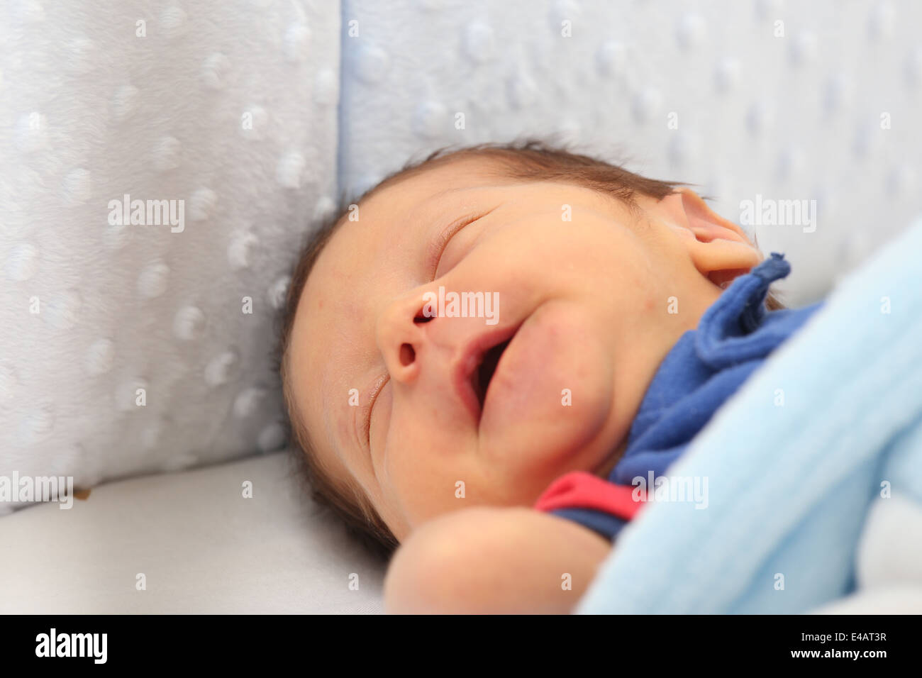 Newborn smiling in his dream Stock Photo - Alamy