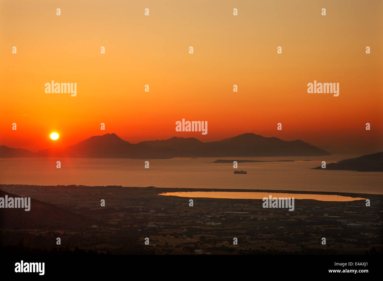 Sun setting behind Kalymnos island. Photo taken from Dikaios mountain ...