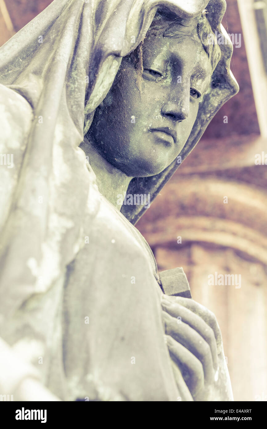 bronze sculpture of maria with red background Stock Photo - Alamy