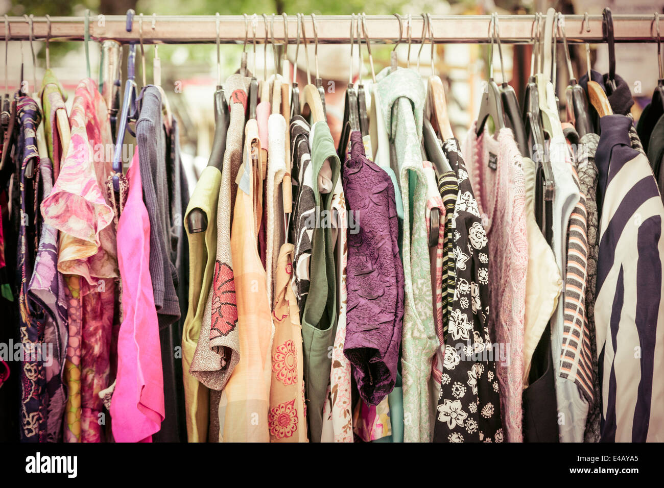 clothes on a rack on a flea market Stock Photo - Alamy