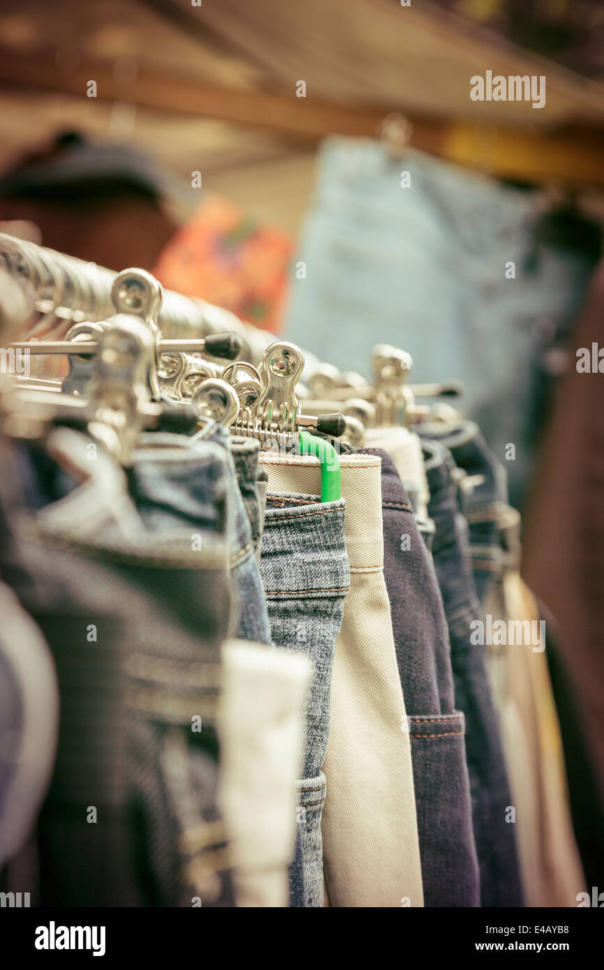 clothes on a rack on a flea market Stock Photo - Alamy